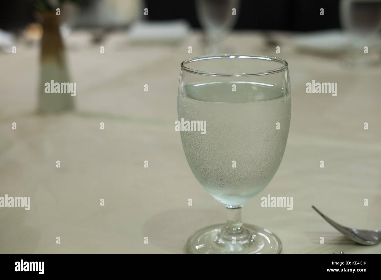 glass of water on table. food court, cafeteria, modern restaurant ...