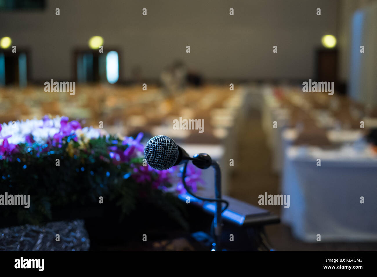 microphone in modern conference hall interior with white chairs ...