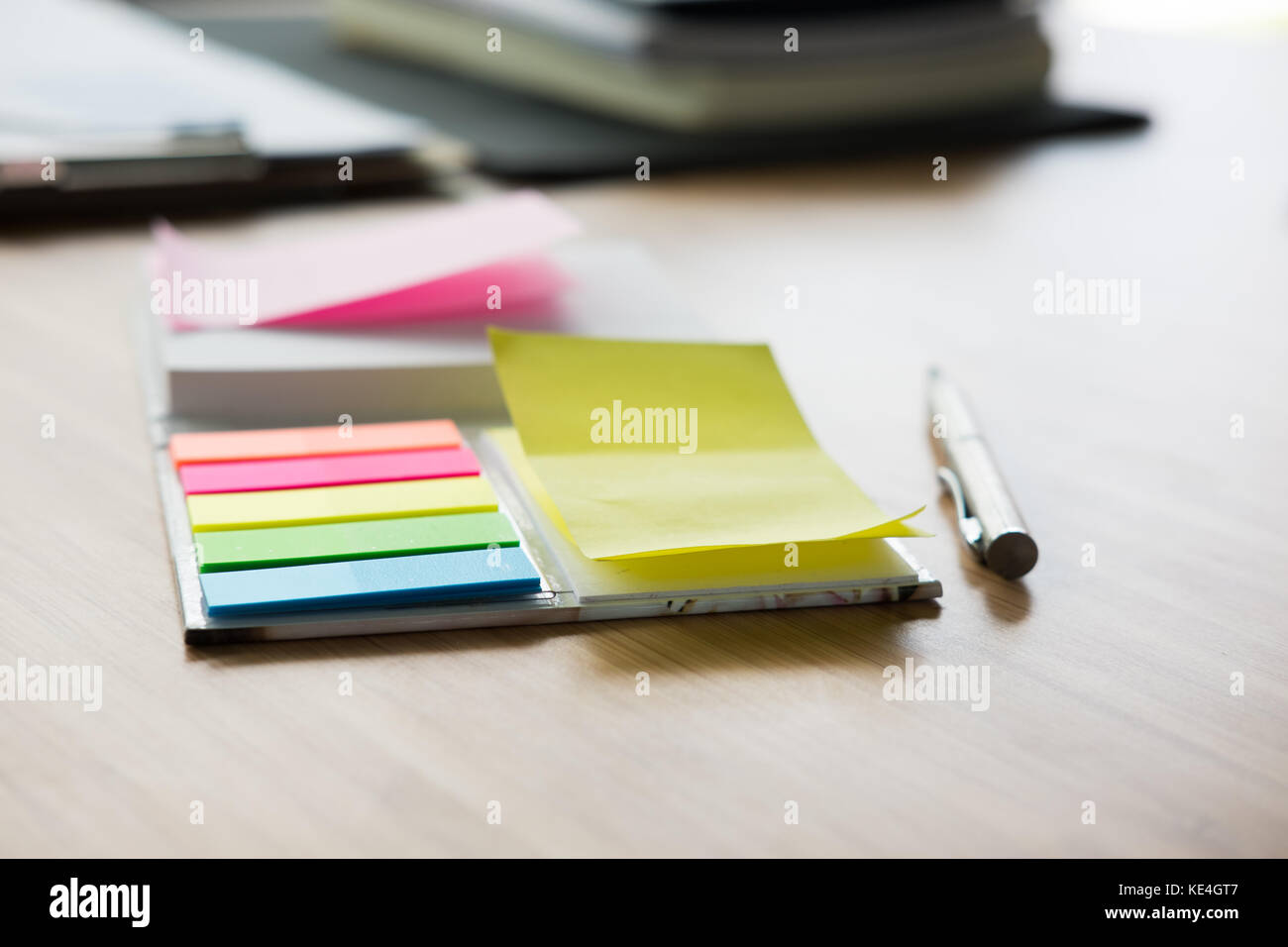 sticky note, ballpoint pen, notebook on wood office desk. business ...