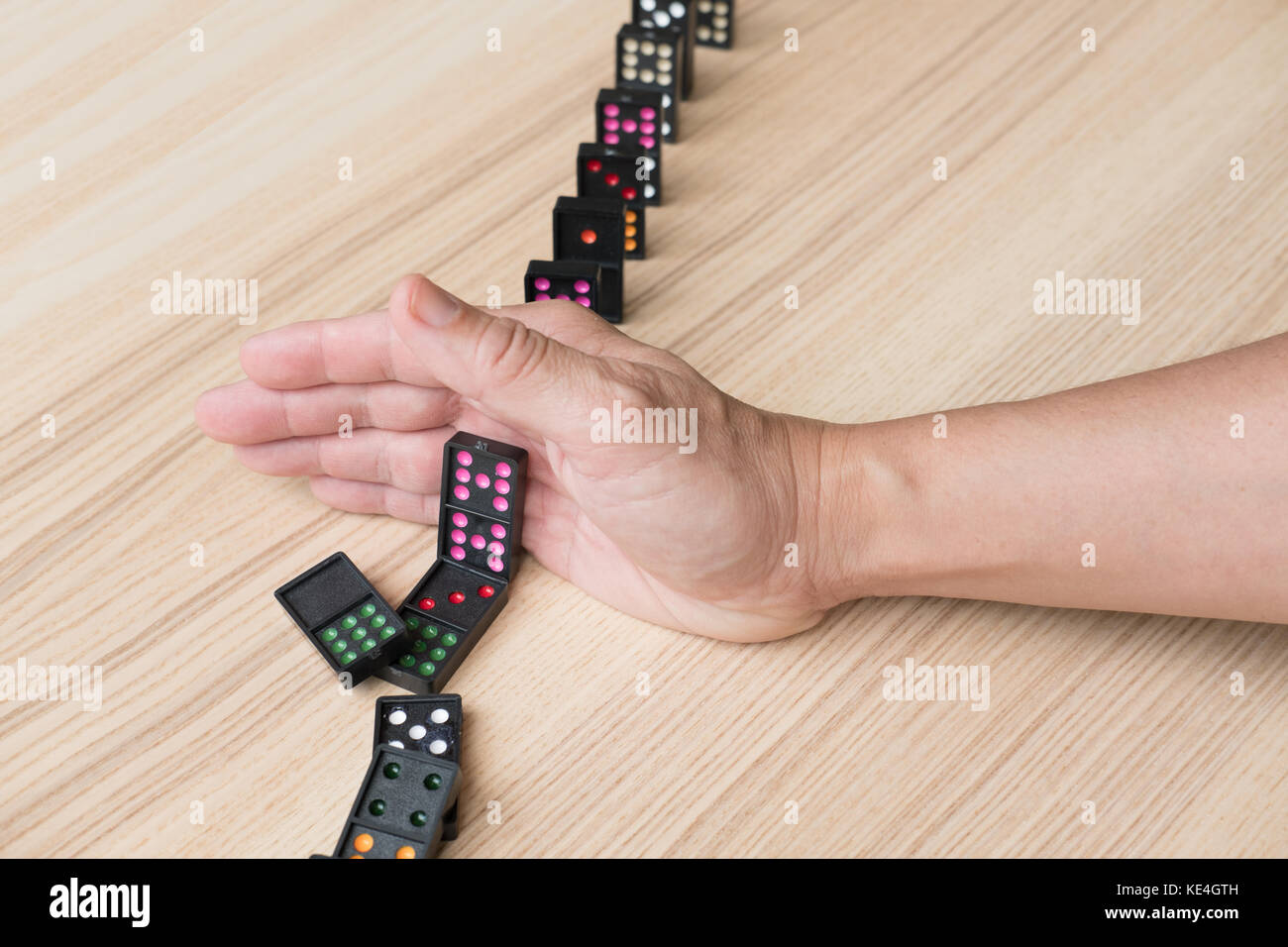 hand stop continuous toppled. prevent chain reaction domino effect ...