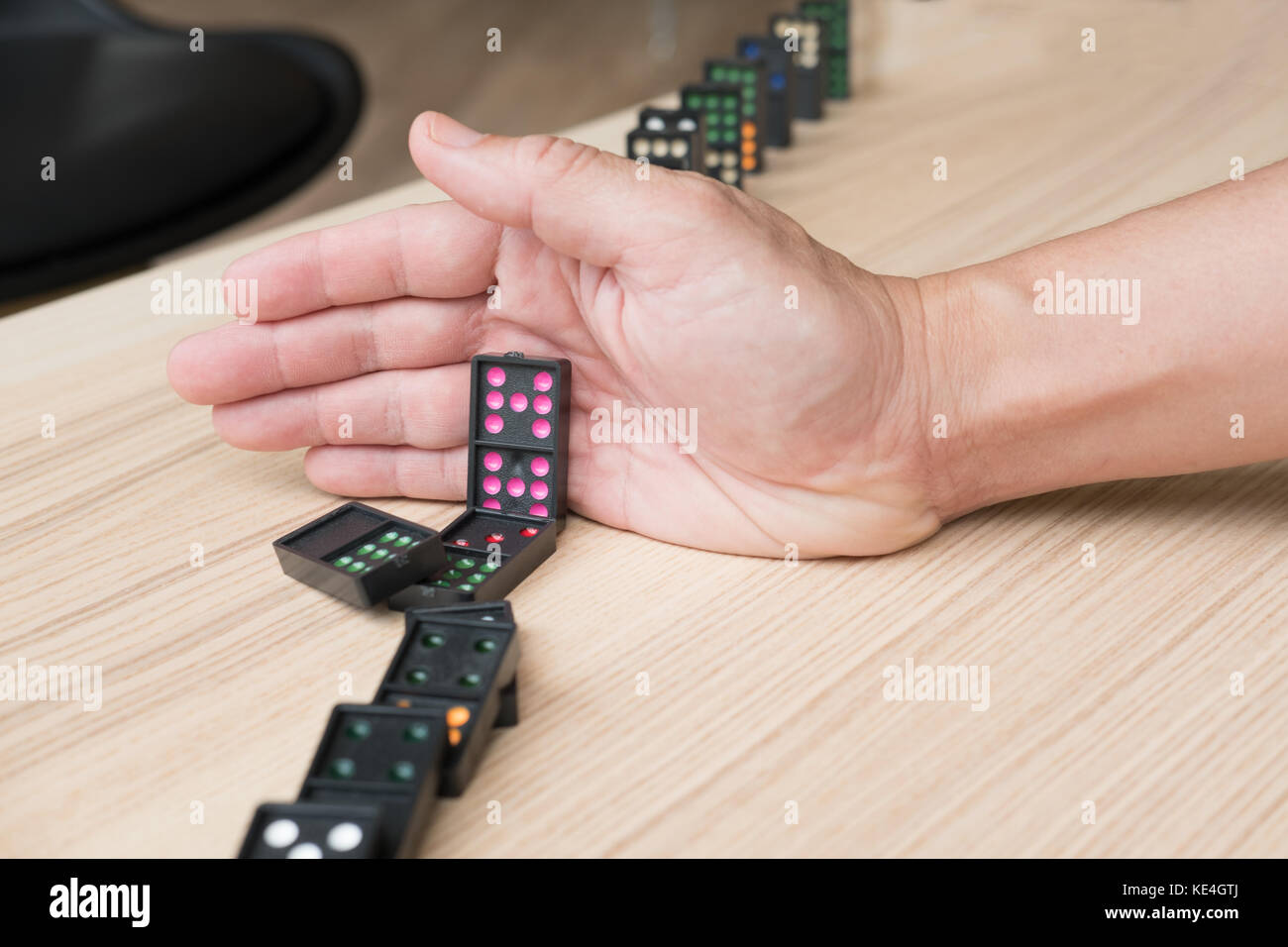 hand stop continuous toppled. prevent chain reaction domino effect ...