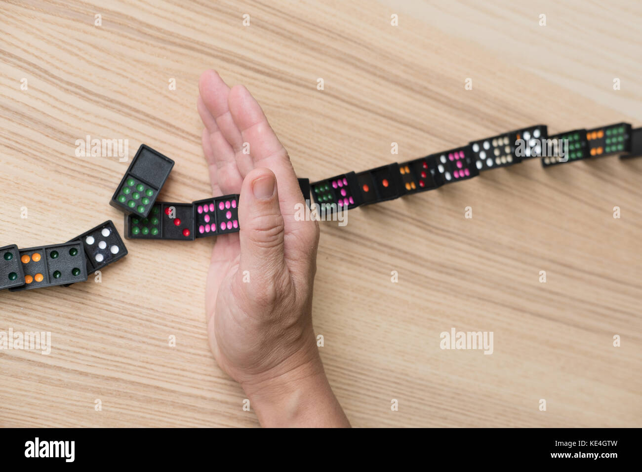 hand stop continuous toppled. prevent chain reaction domino effect ...