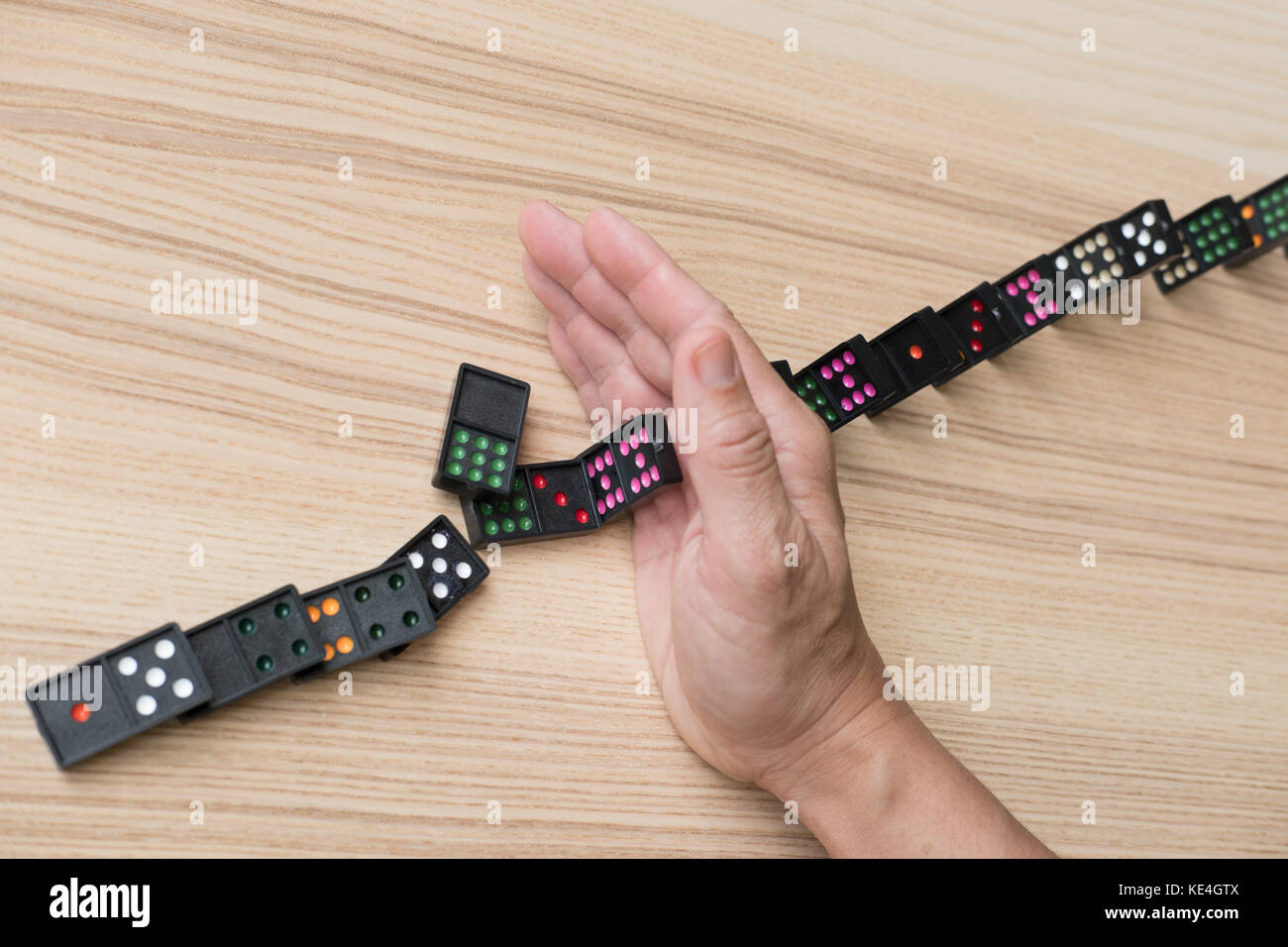 hand stop continuous toppled. prevent chain reaction domino effect ...