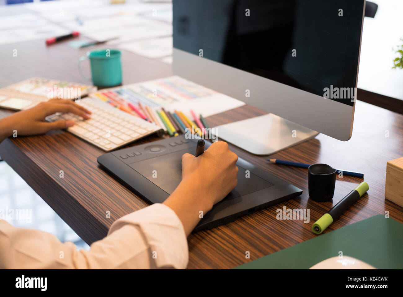 interior designer drawing on graphic tablet at office. artist working ...