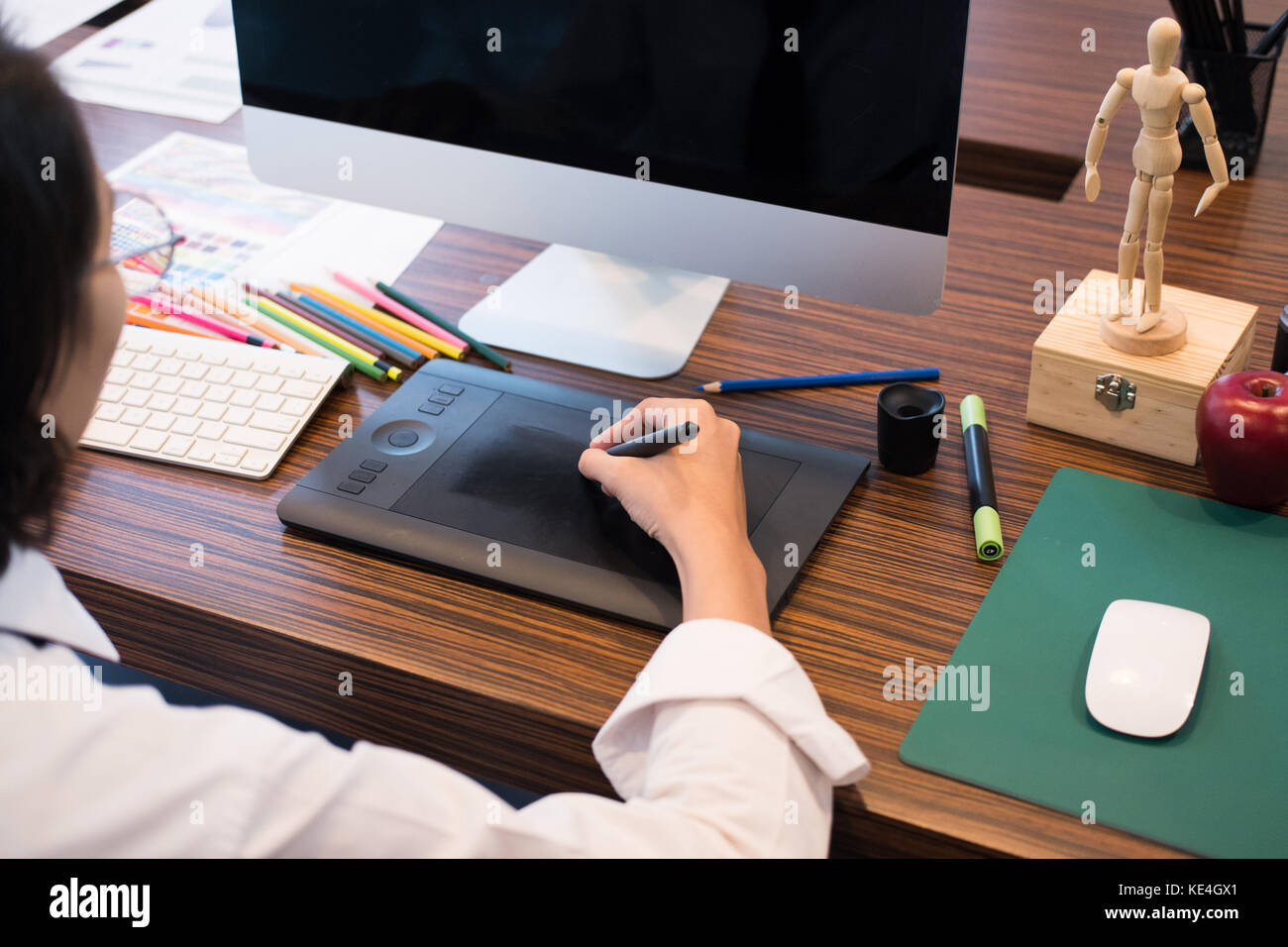 interior designer drawing on graphic tablet at office. artist working ...