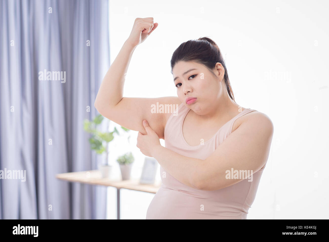 Portrait of young fat woman gloomy Stock Photo - Alamy