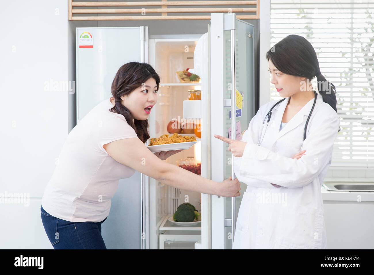 A woman opening refrigerator hi-res stock photography and images - Alamy