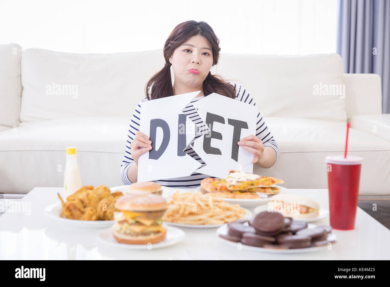 Portrait of young fat woman gloomy failing in diet Stock Photo - Alamy