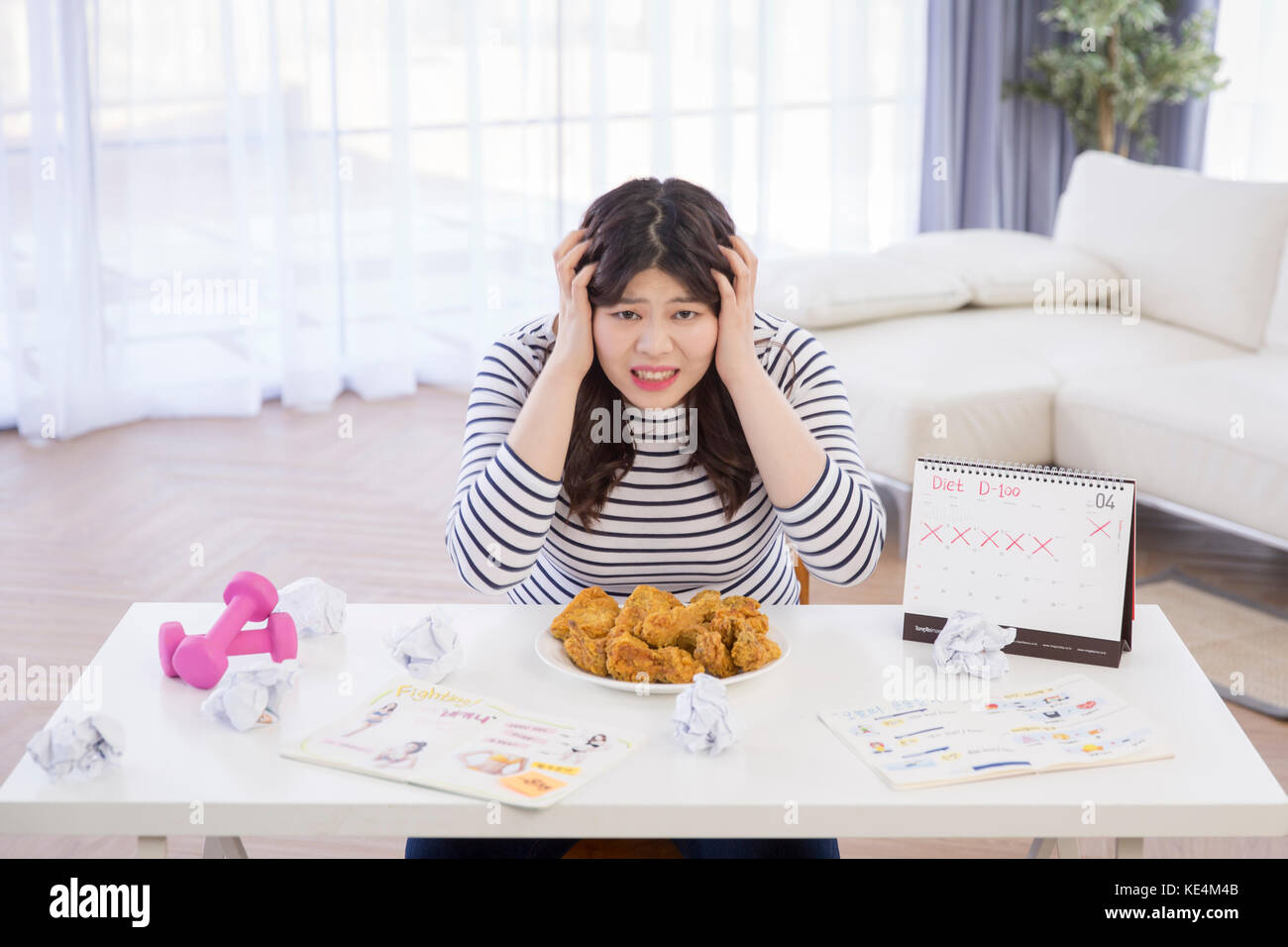 Portrait of young stressful fat woman with fast-food Stock Photo - Alamy