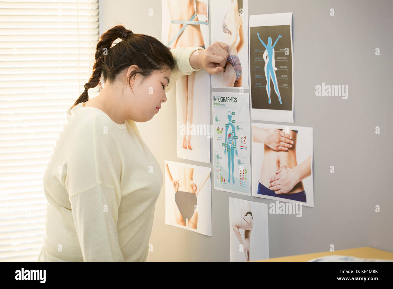 Side view of young fat woman gloomy Stock Photo - Alamy