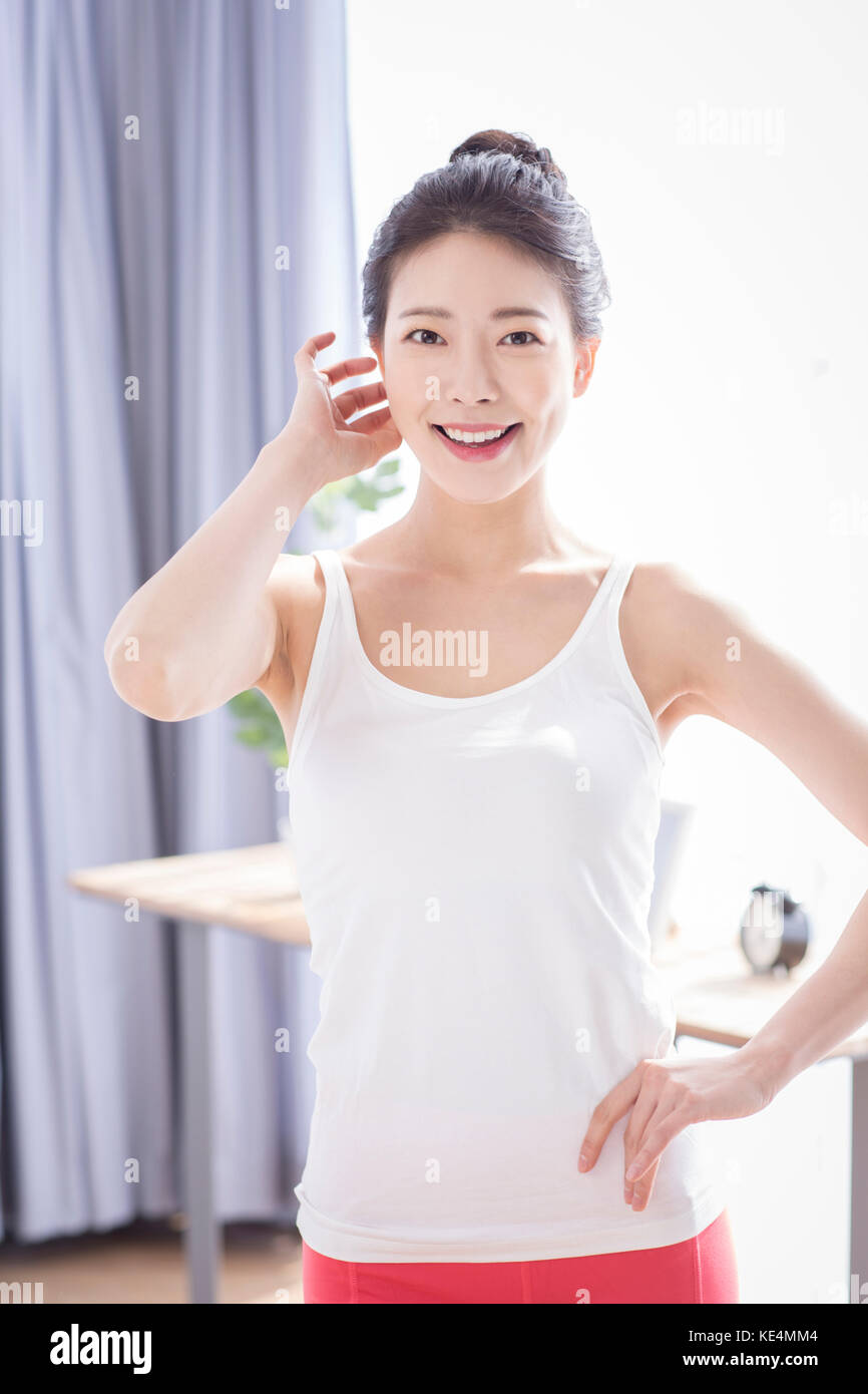 Young smiling slim confident woman Stock Photo - Alamy