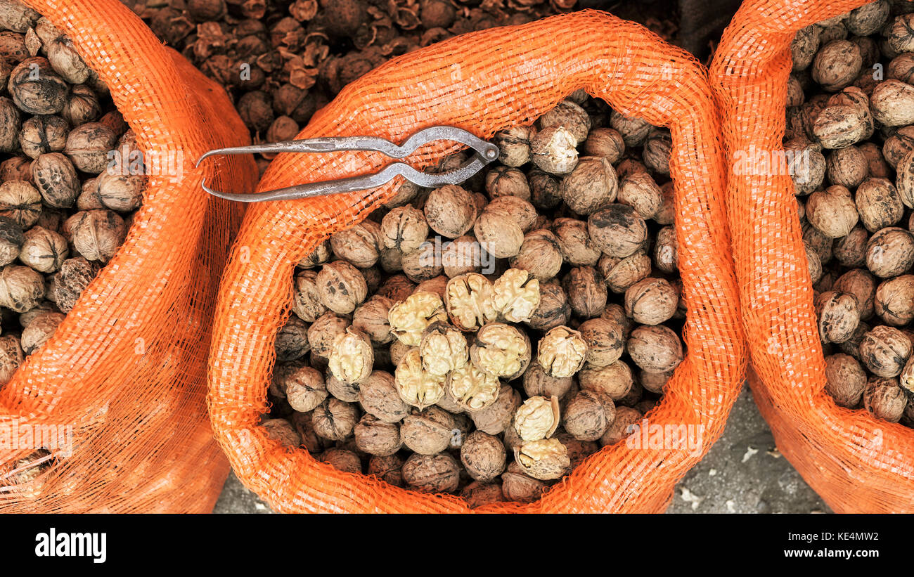 Close up picture of walnuts in a bag on a local market, selective focus ...