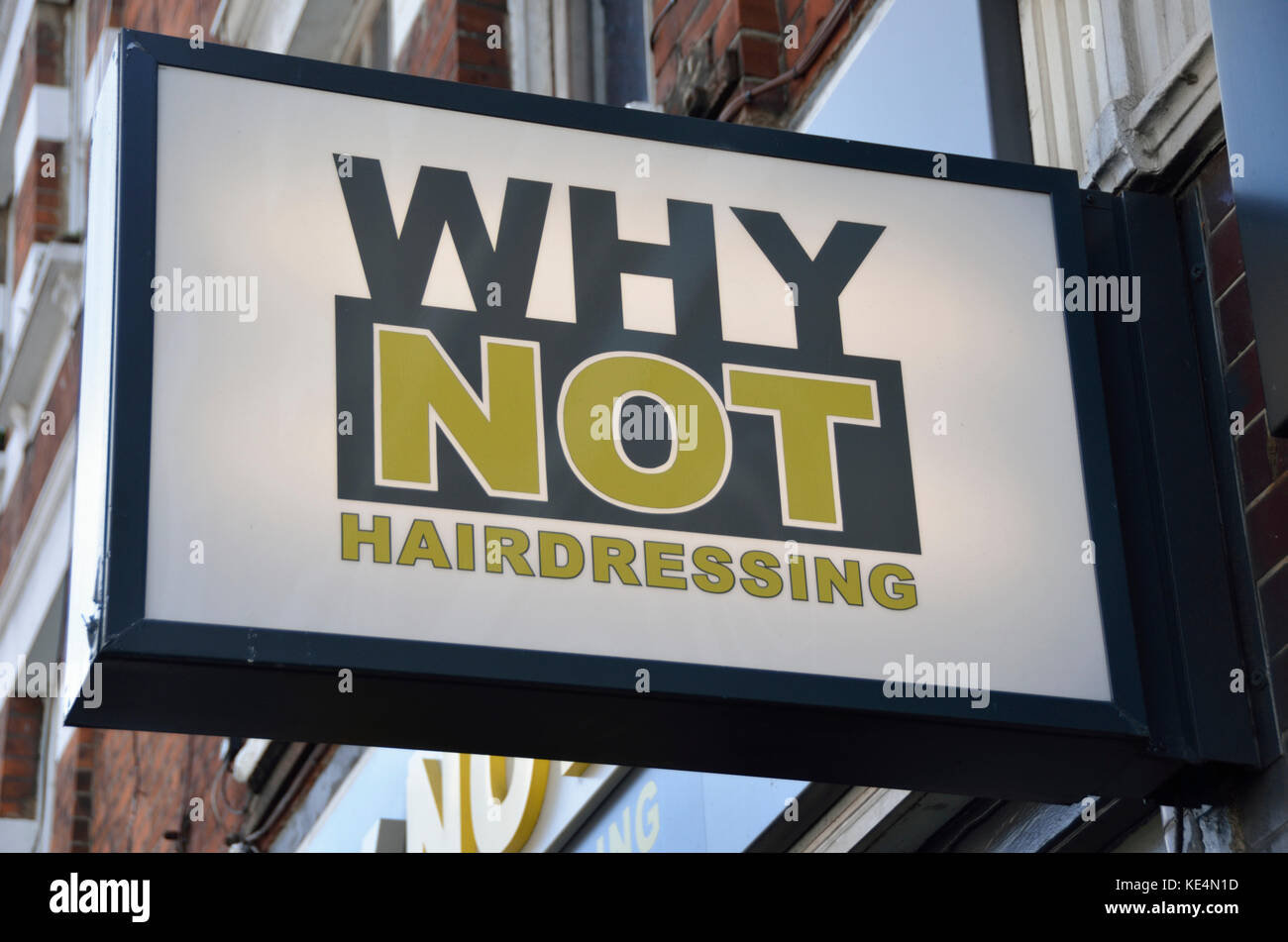 Why Not hairdressing sign outside a shop Stock Photo - Alamy