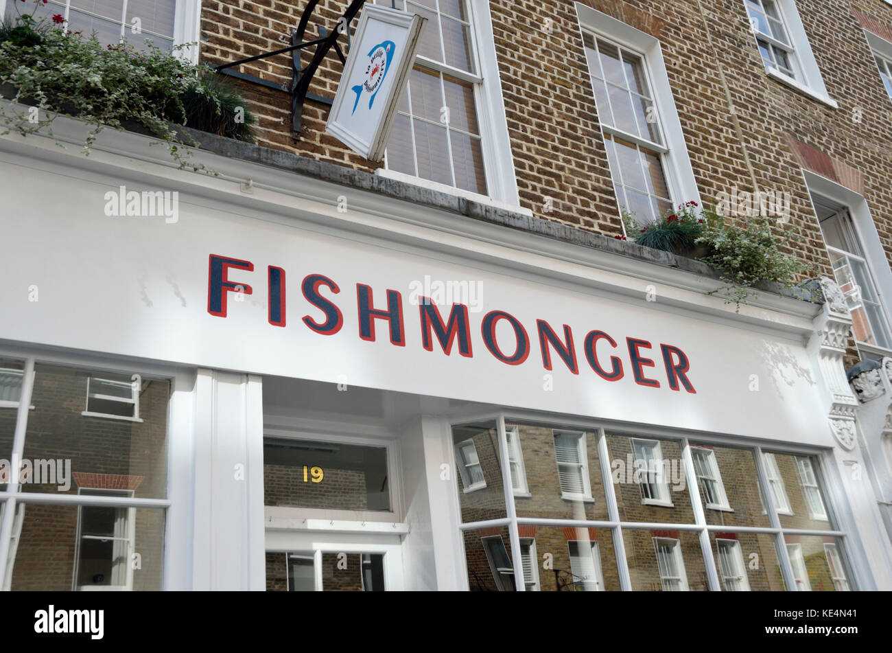 Fishmonger sign on shop exterior Stock Photo - Alamy