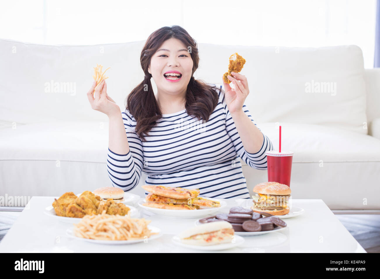 Overeating sweets hi-res stock photography and images - Alamy