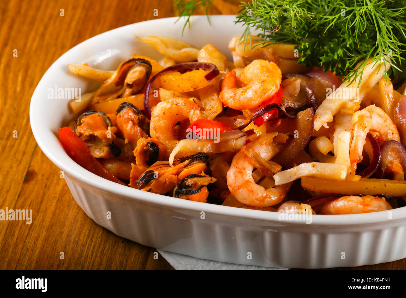 Seafood cocktail with squid, mussels and shrimps Stock Photo - Alamy