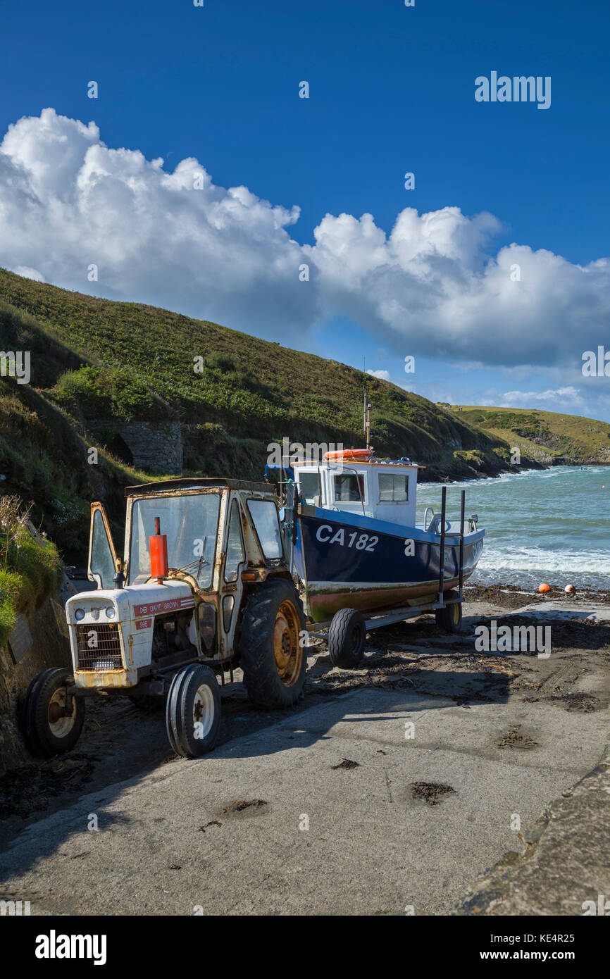 Small fishing boat on a trailer pulled by a vintage tractor Stock Photo ...