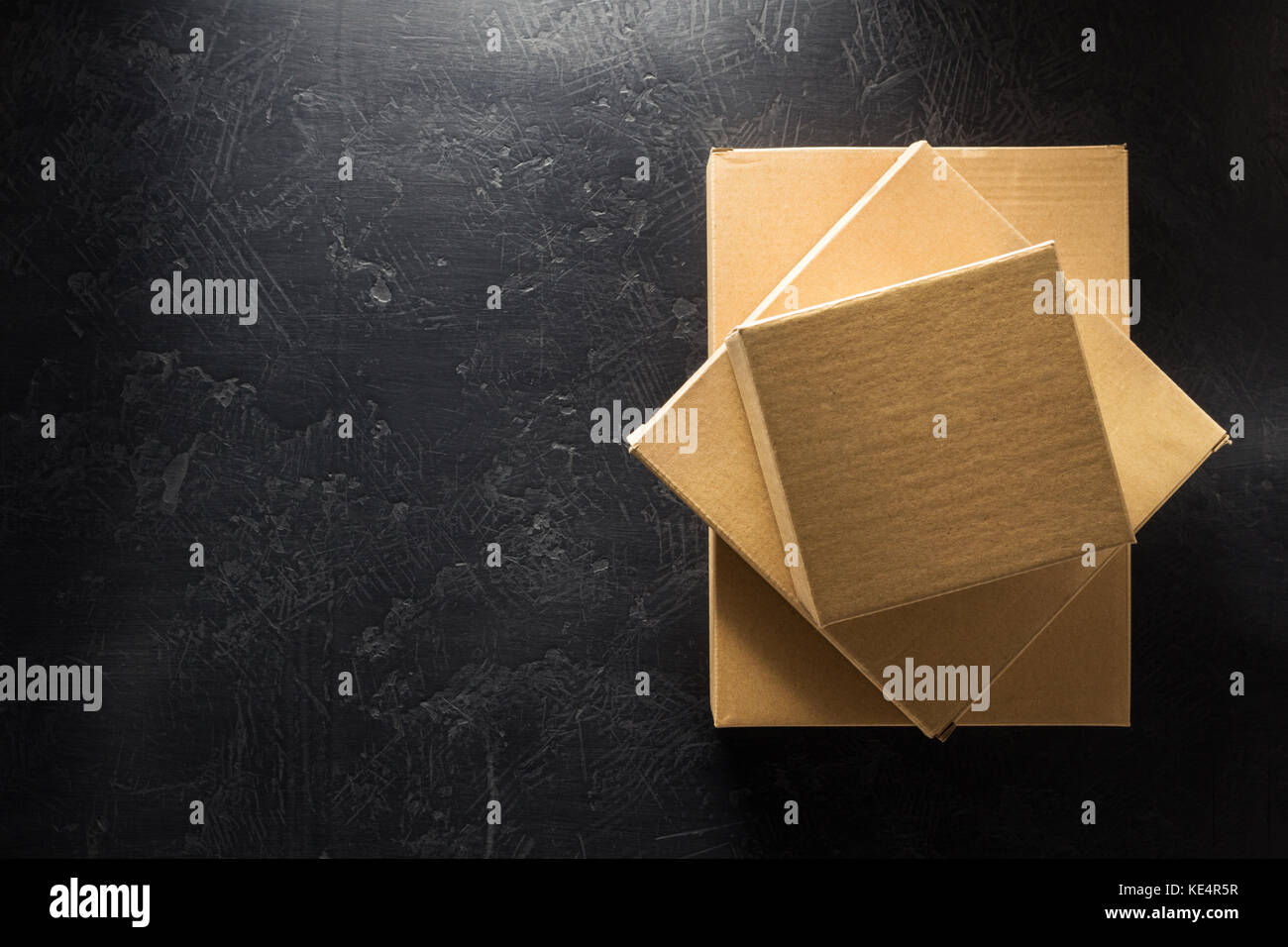 cardboard box at black background surface Stock Photo - Alamy