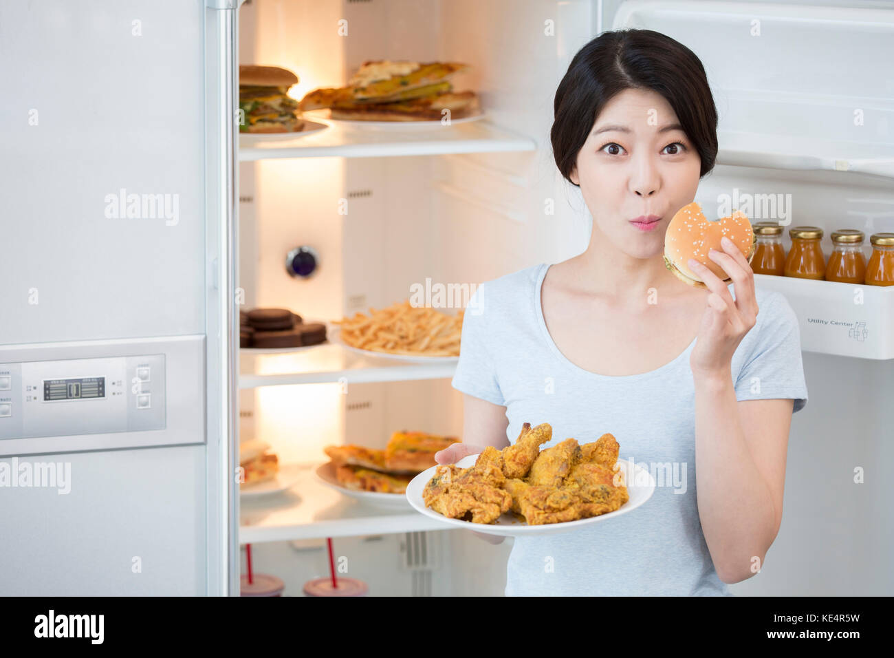 Woman eating fried chicken asian hi-res stock photography and images ...