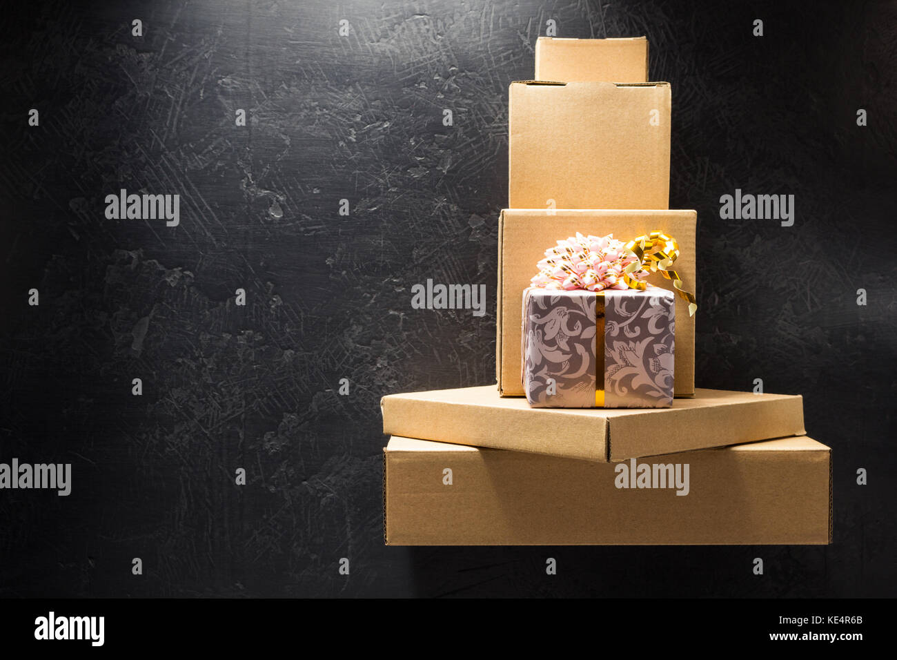 cardboard box at black background surface Stock Photo - Alamy