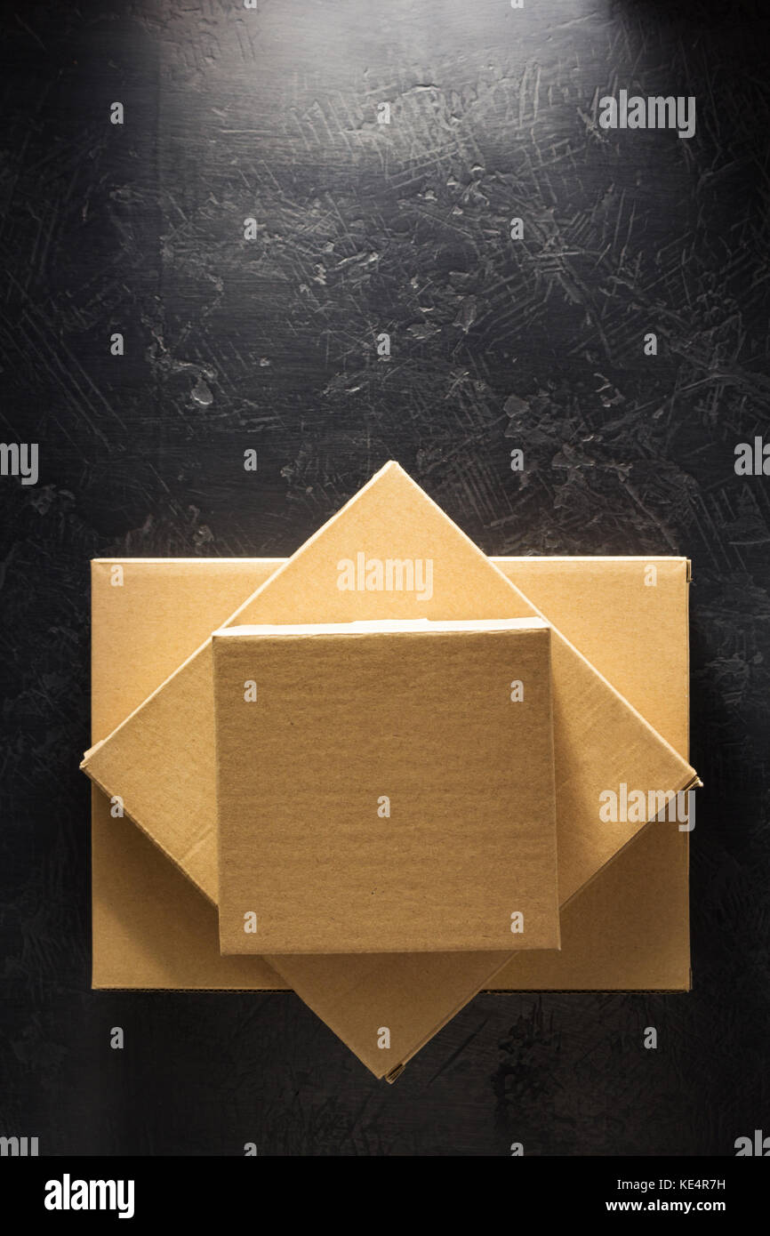 cardboard box at black background surface Stock Photo - Alamy