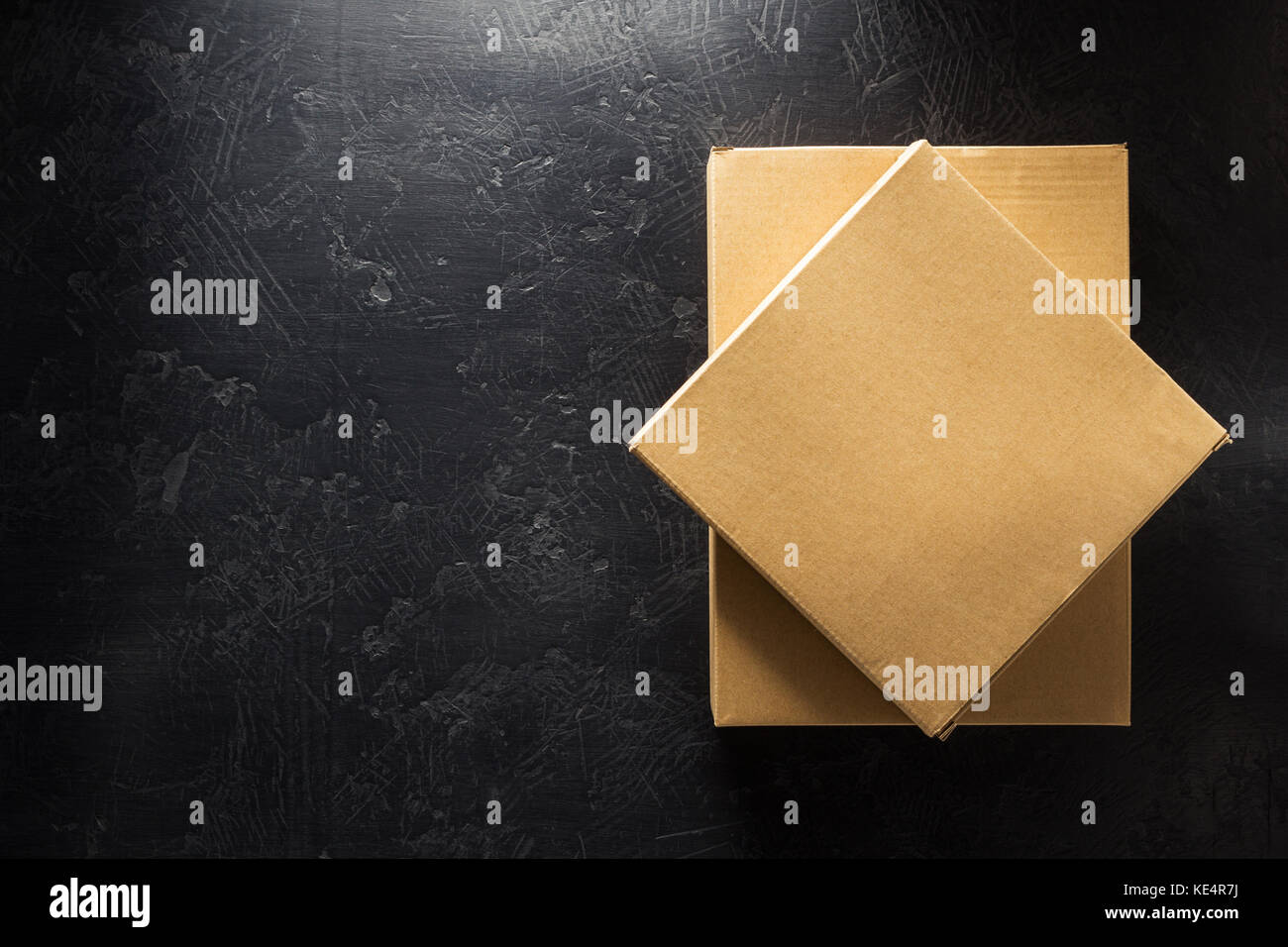 cardboard box at black background surface Stock Photo - Alamy