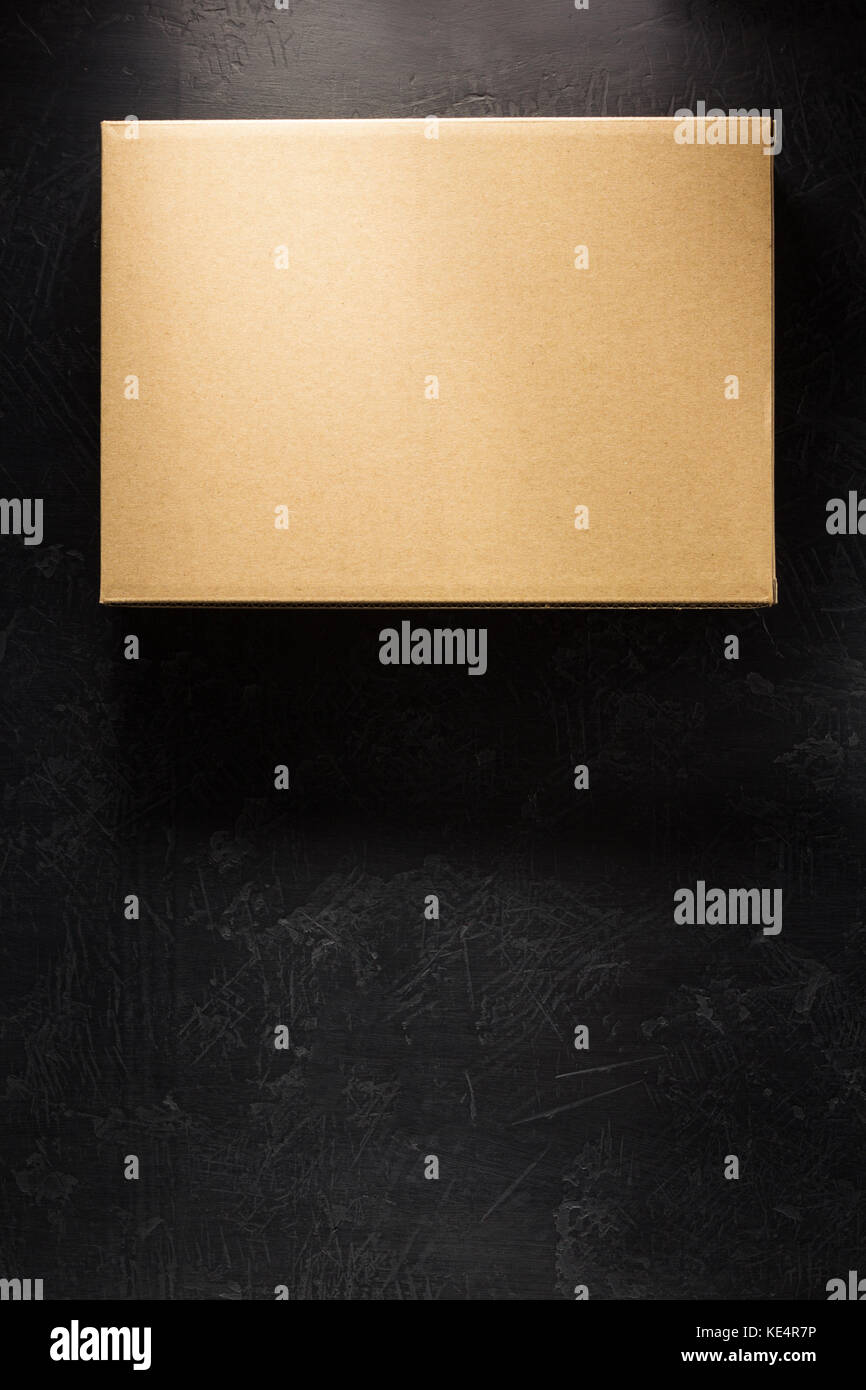 cardboard box at black background surface Stock Photo - Alamy