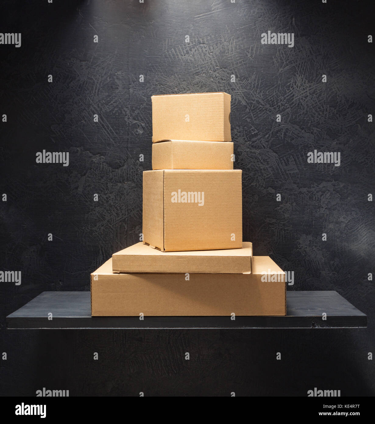 cardboard box at black background surface Stock Photo - Alamy