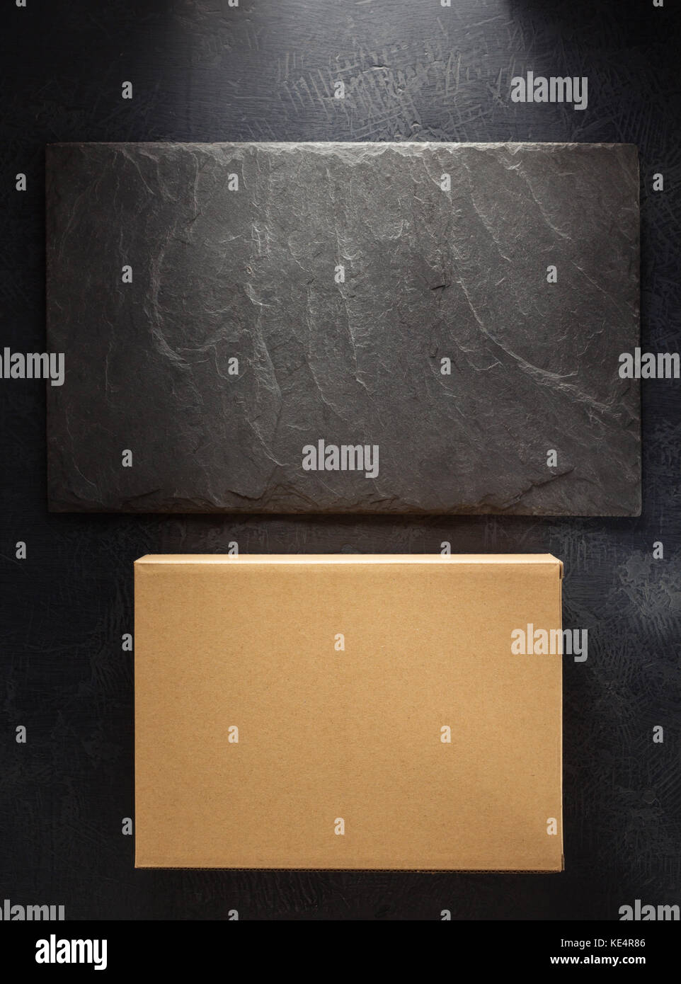 cardboard box at black background surface Stock Photo - Alamy