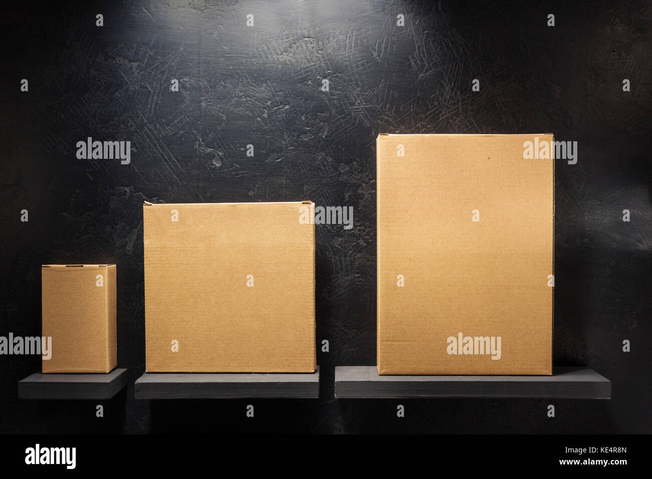 cardboard box at black background surface Stock Photo - Alamy