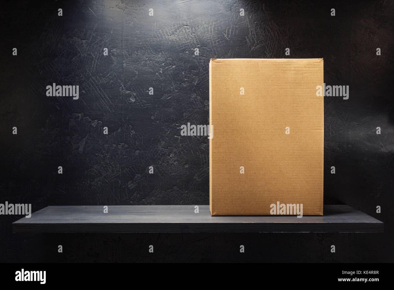 cardboard box at black background surface Stock Photo - Alamy