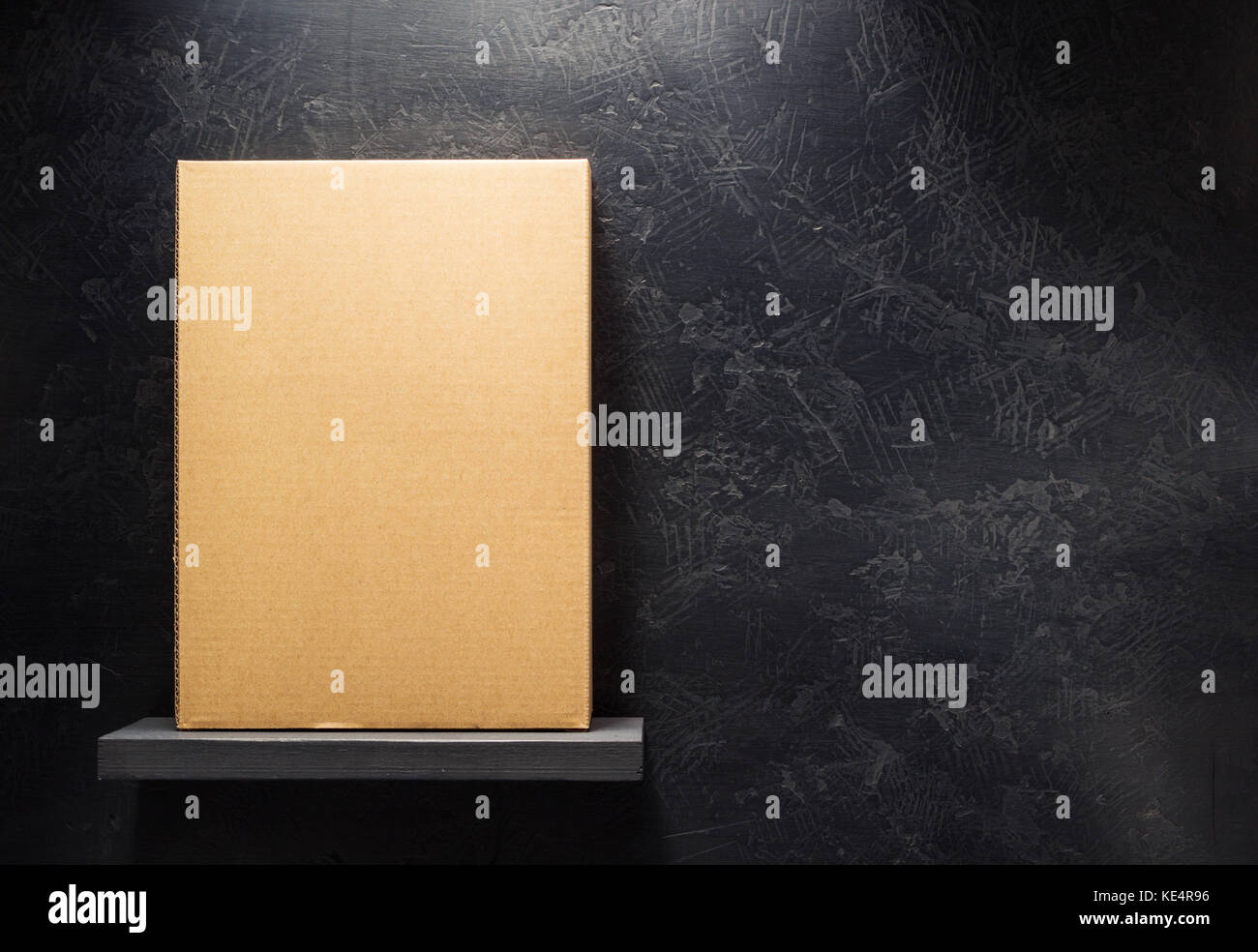 cardboard box at black background surface Stock Photo - Alamy
