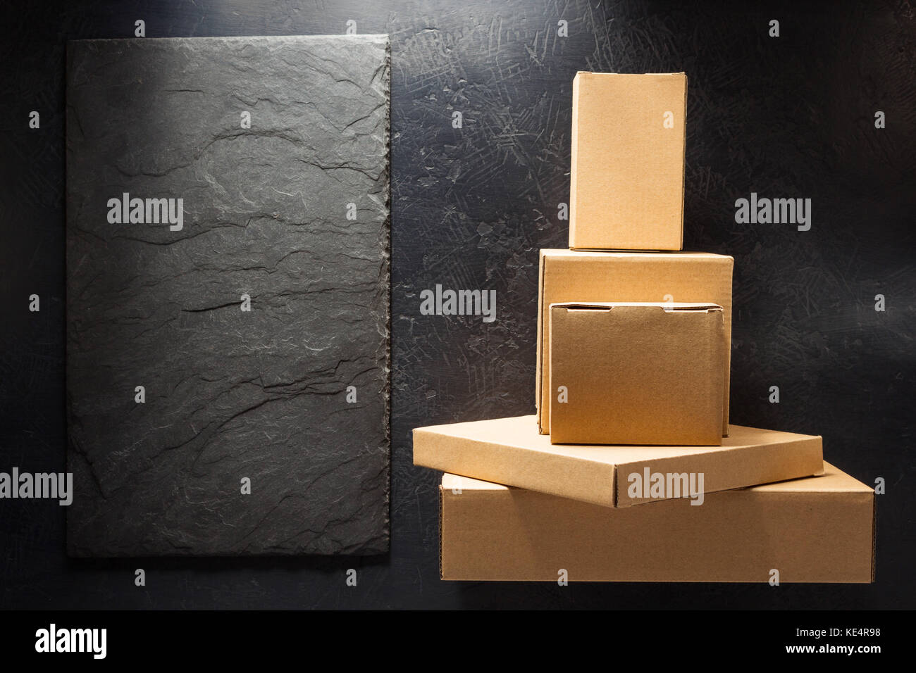 cardboard box at black background surface Stock Photo - Alamy