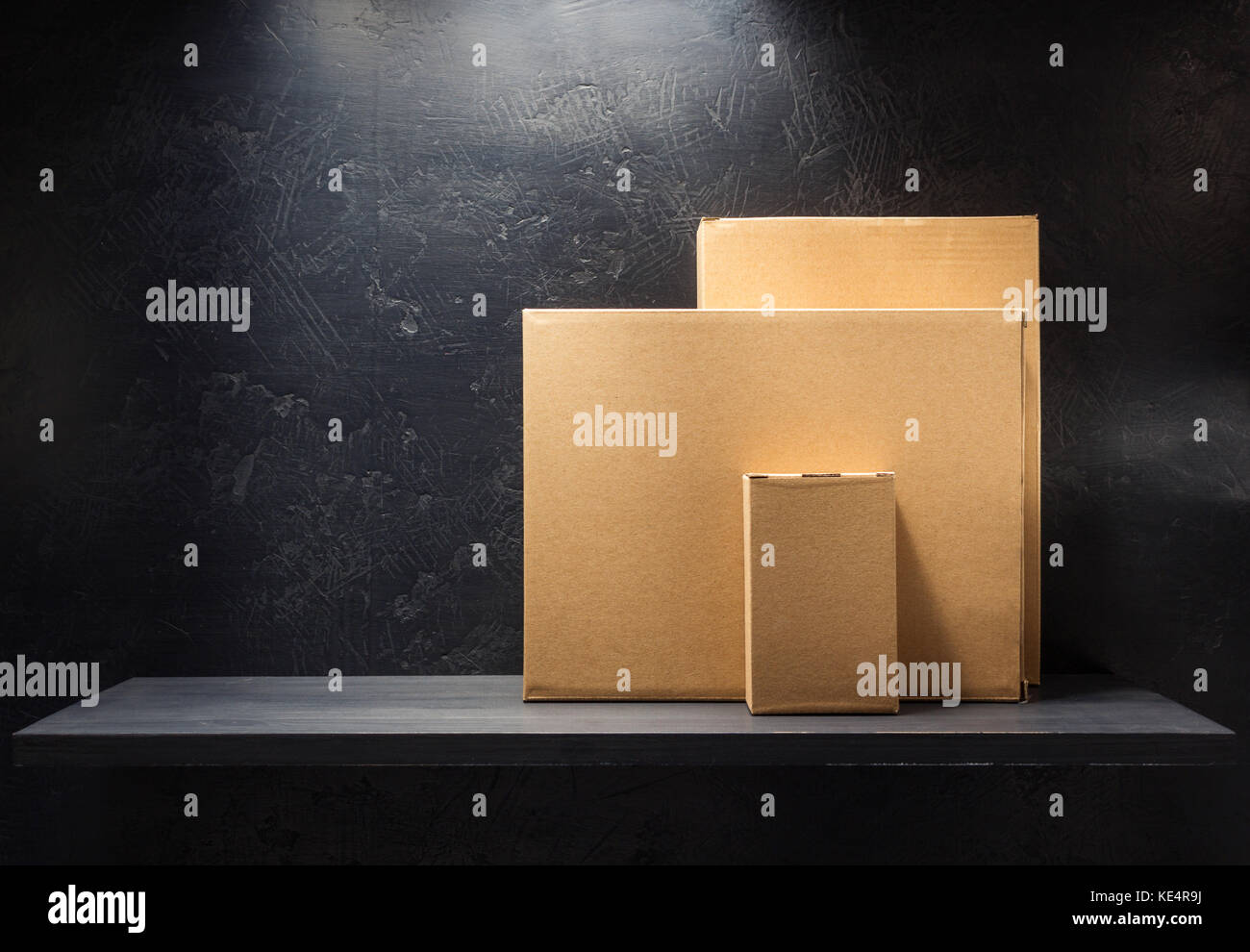 cardboard box at black background surface Stock Photo - Alamy