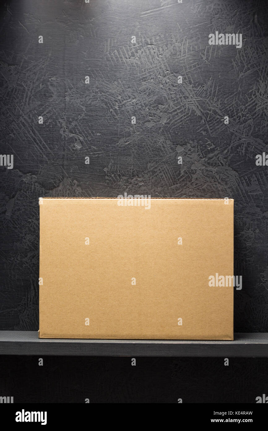 cardboard box at black background surface Stock Photo - Alamy