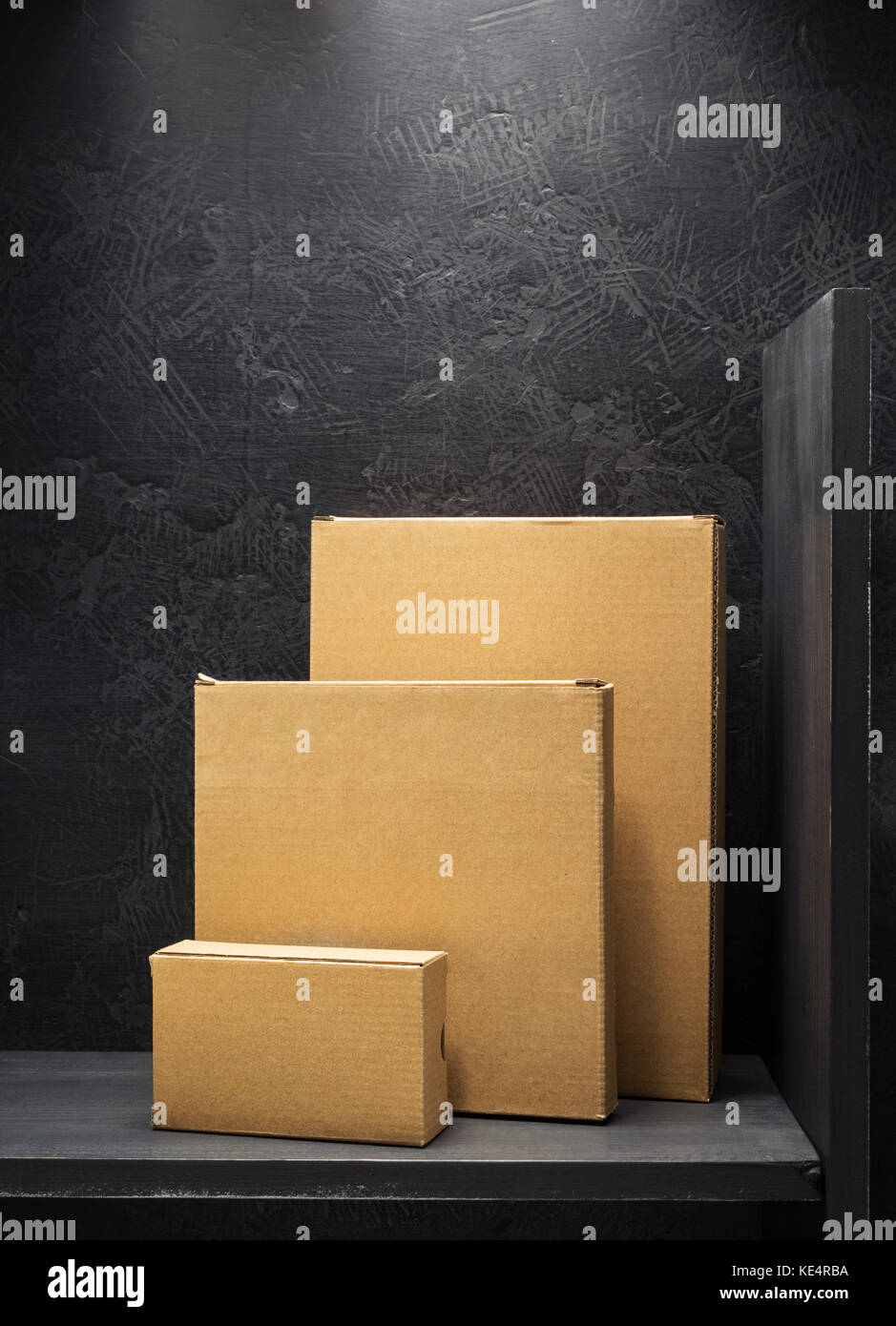 cardboard box at black background surface Stock Photo - Alamy