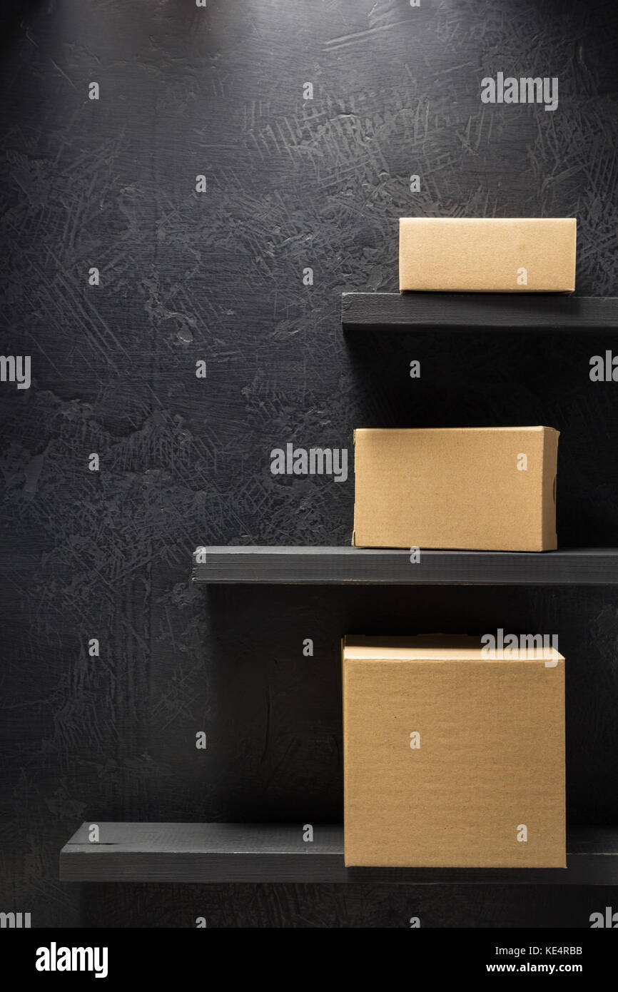 cardboard box at black background surface Stock Photo - Alamy