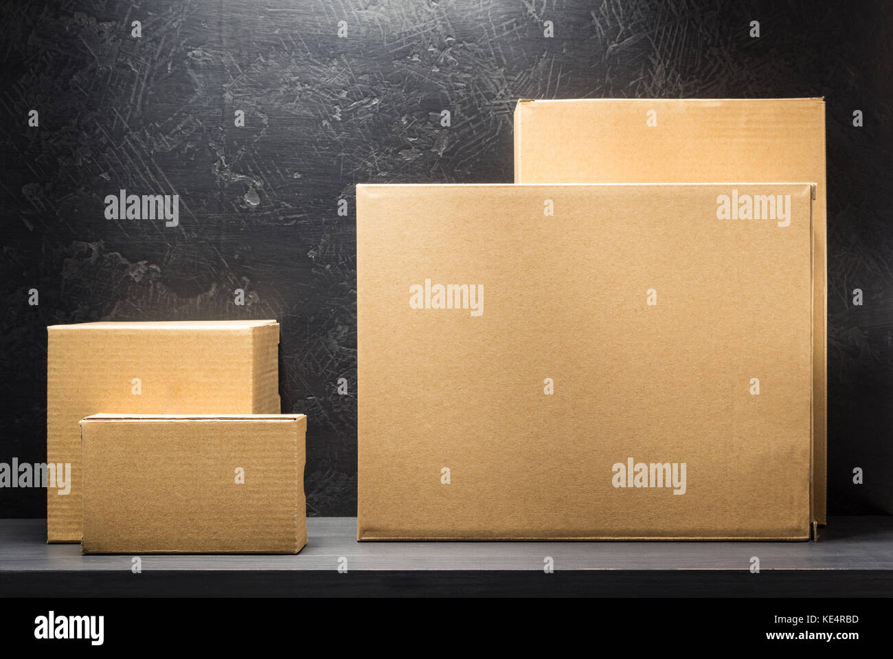 cardboard box at black background surface Stock Photo - Alamy