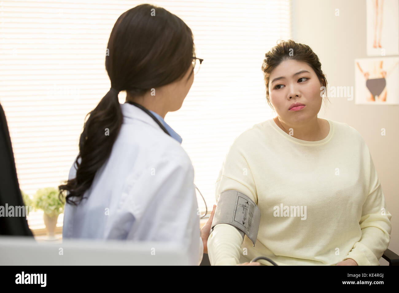Portrait of fat woman and female doctor at obesity clinic Stock Photo ...