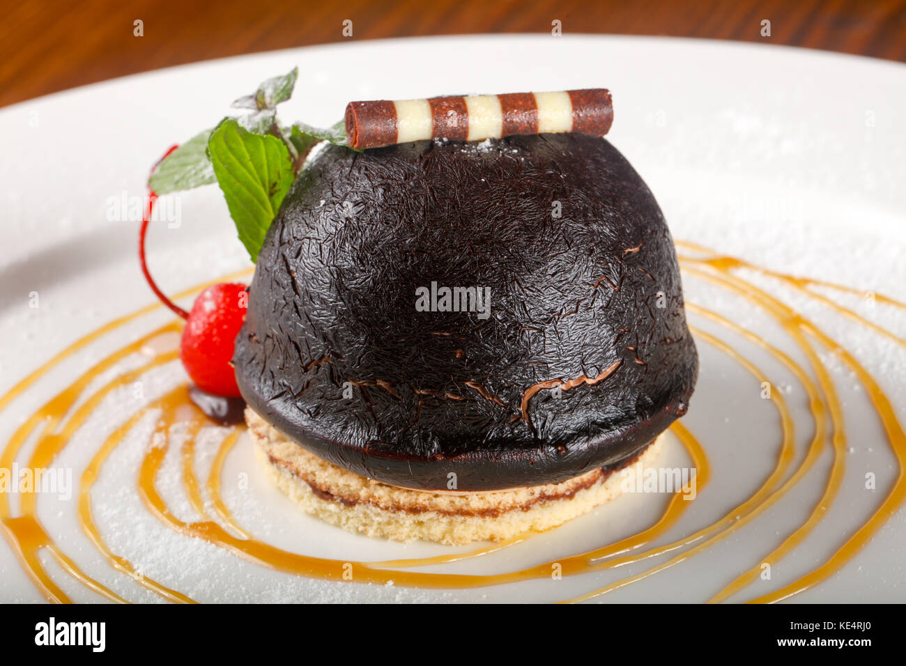 Chocolate cake with cherry and mint Stock Photo - Alamy