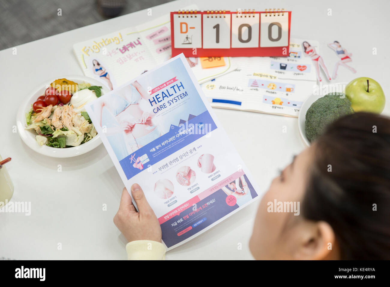 Portrait of young fat woman making a diet plan Stock Photo - Alamy