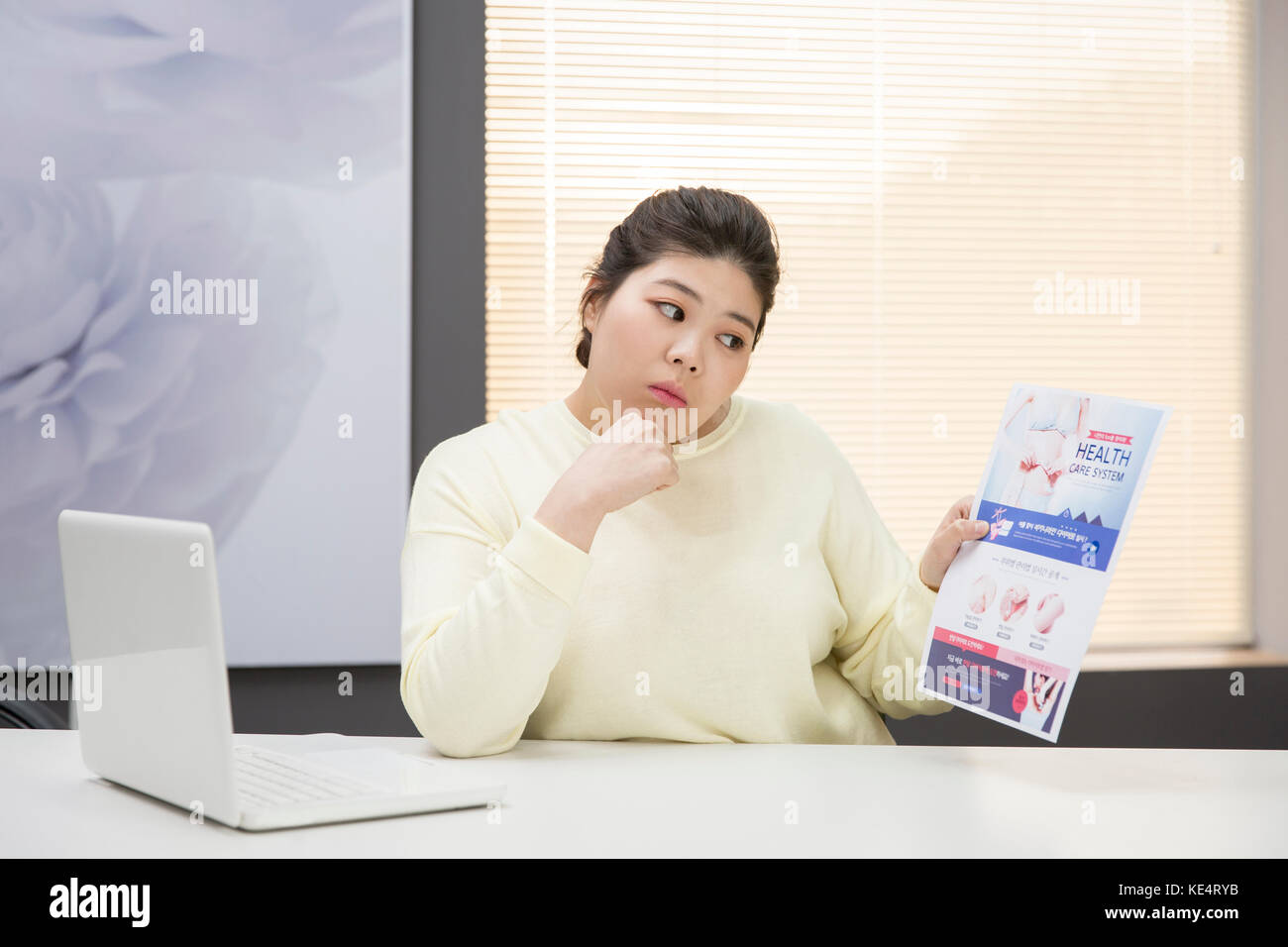 Portrait of young fat woman thinking about diet Stock Photo - Alamy