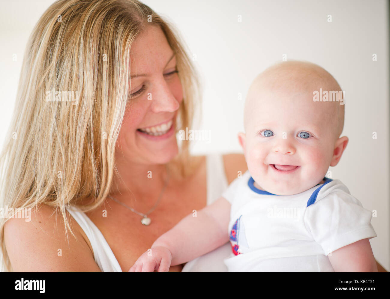 A happy smiling mother and baby Stock Photo - Alamy