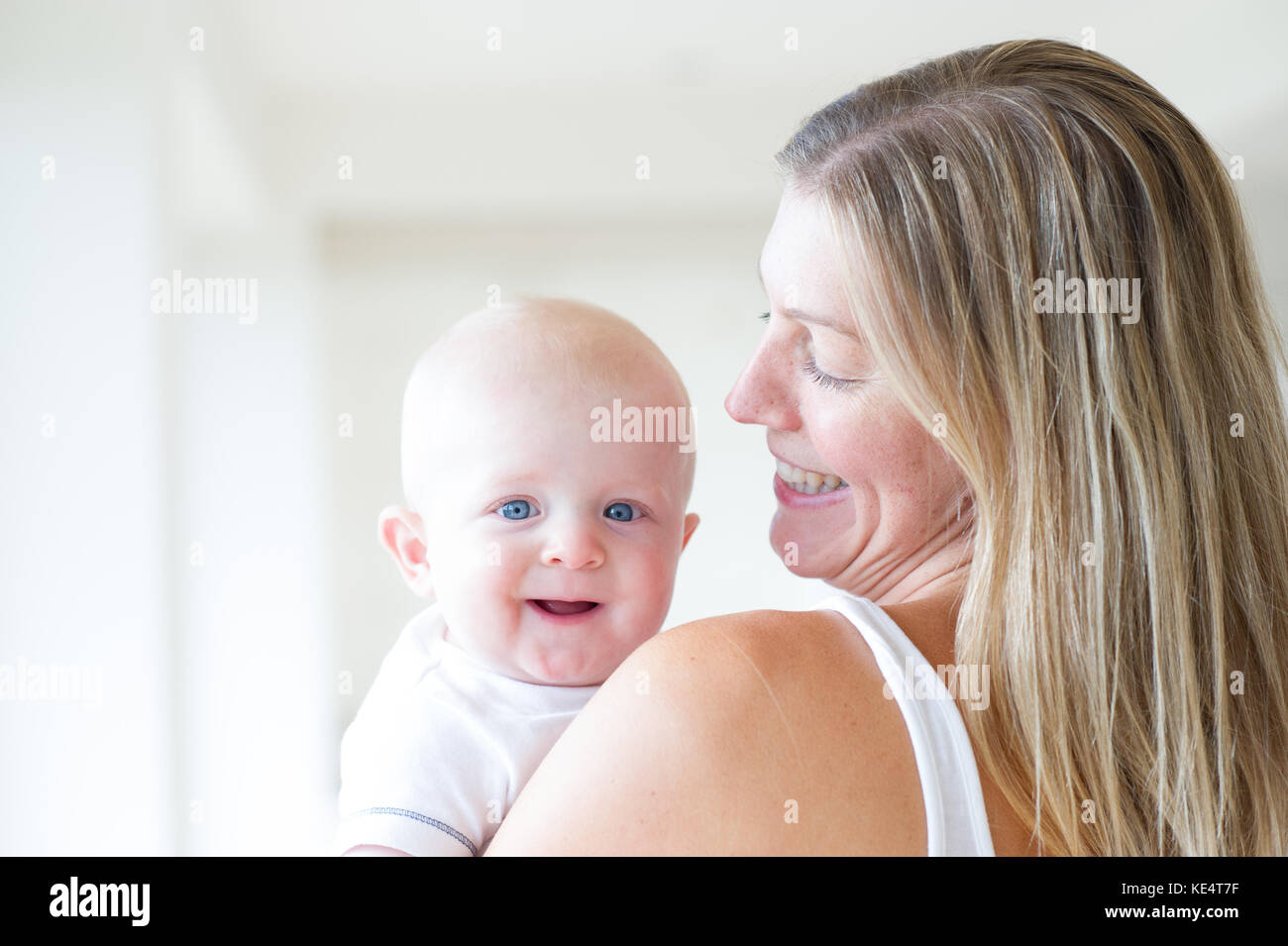 A happy smiling mother and baby Stock Photo - Alamy