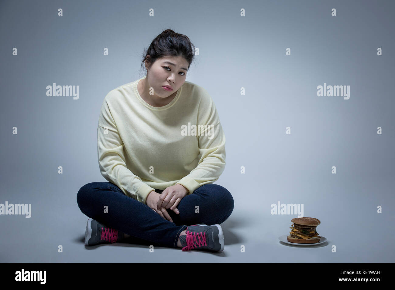 Fat woman gloomy going on diet Stock Photo - Alamy