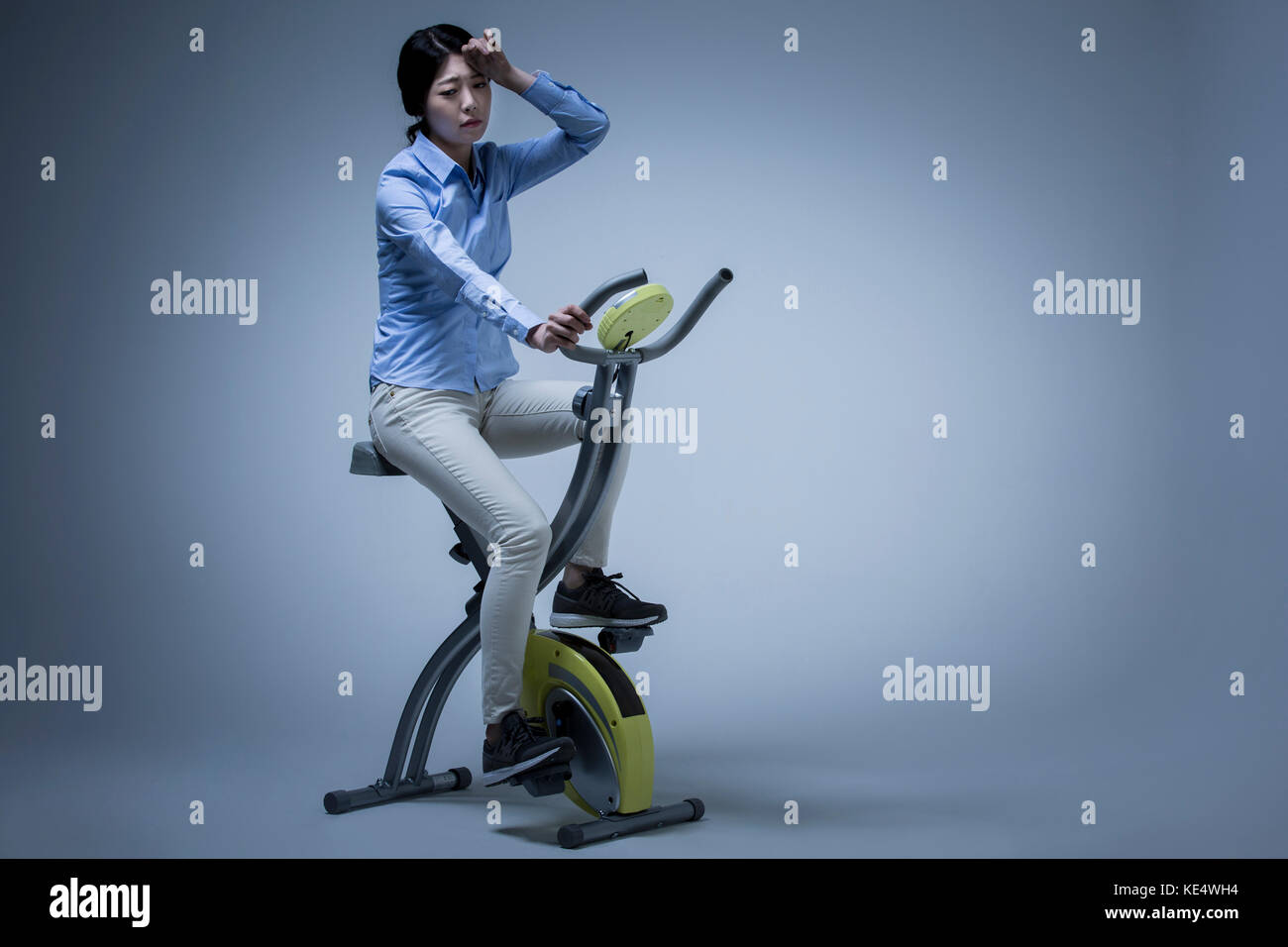 Young woman tired exercising Stock Photo - Alamy