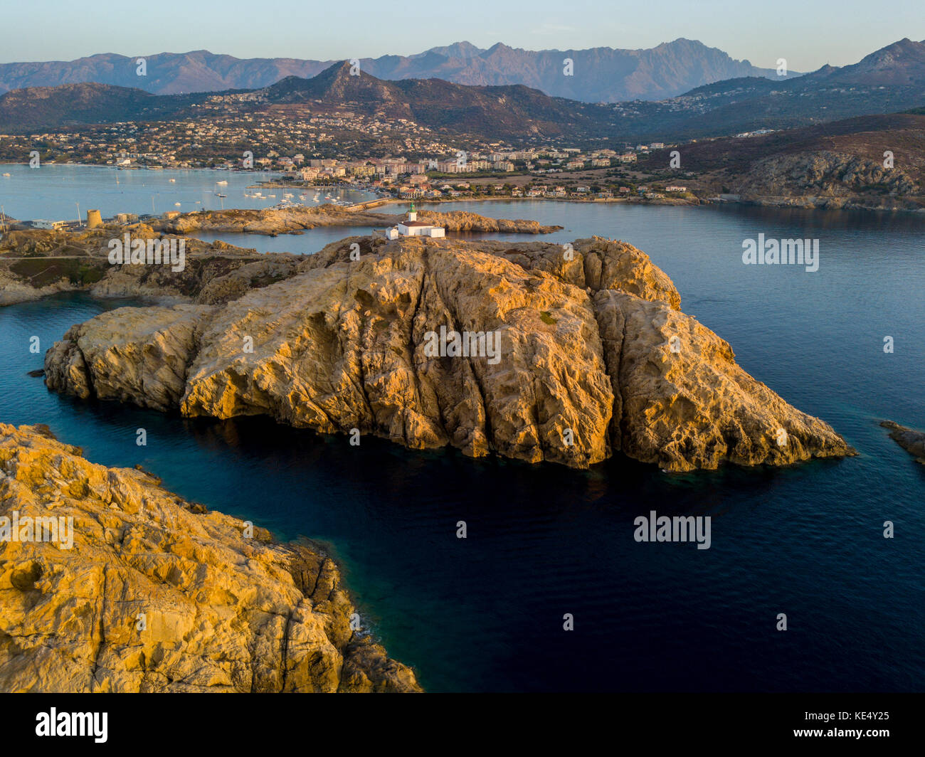 Aerial view of the Pietra Lighthouse at sunset and the Genoese tower, L ...