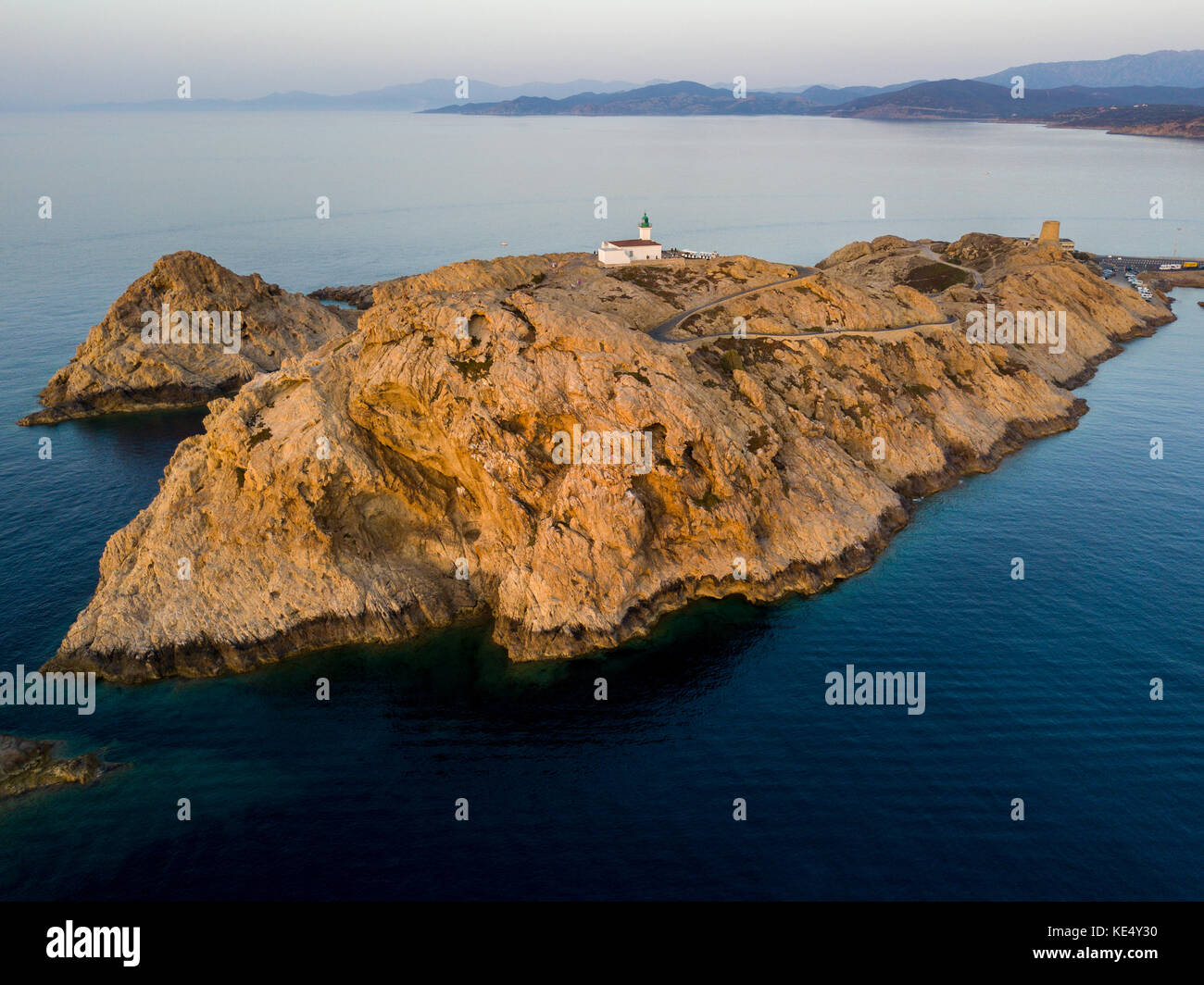 Aerial view of the Pietra Lighthouse at sunset and the Genoese tower, L ...