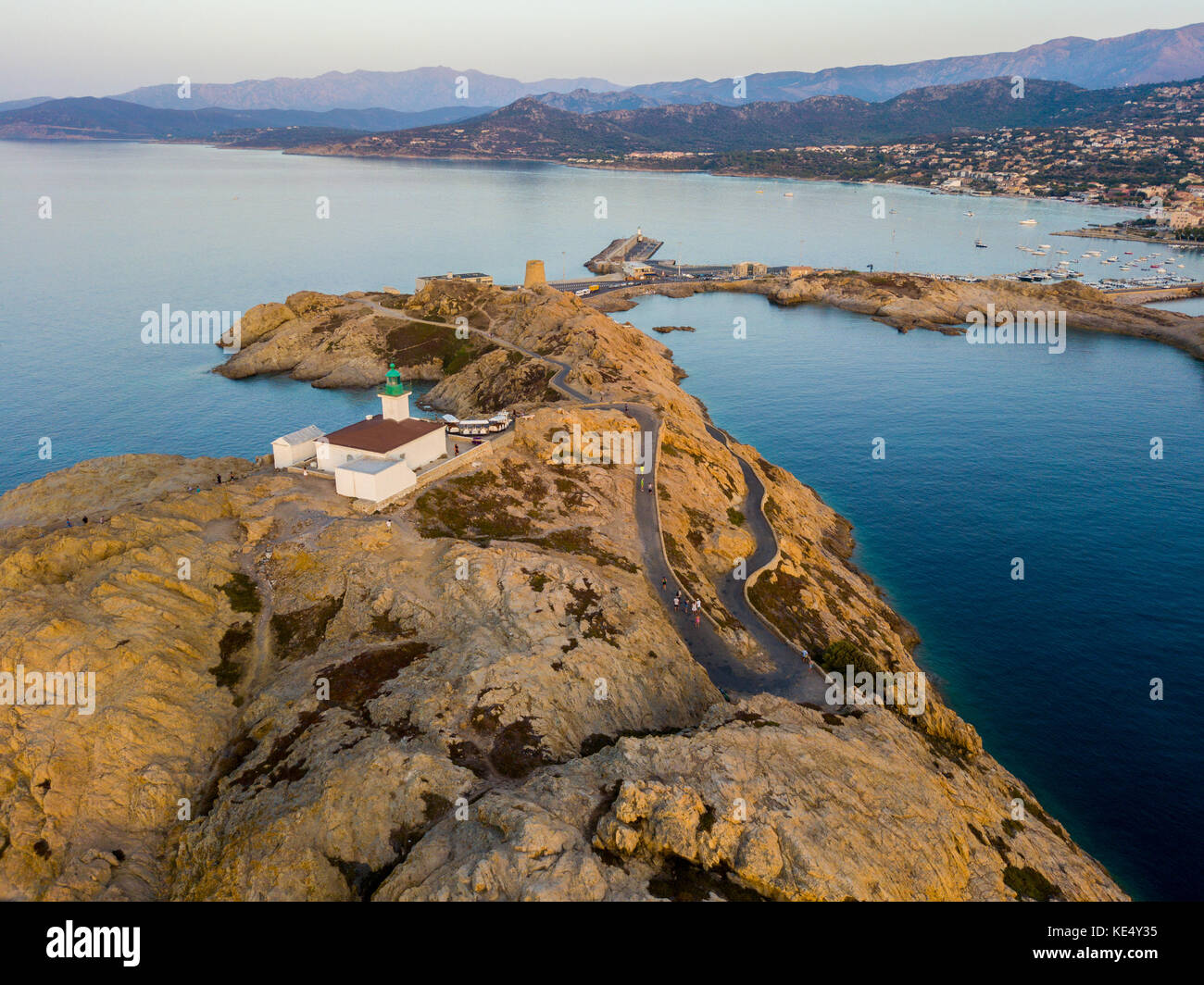 Aerial view of the Pietra Lighthouse at sunset and the Genoese tower, L ...