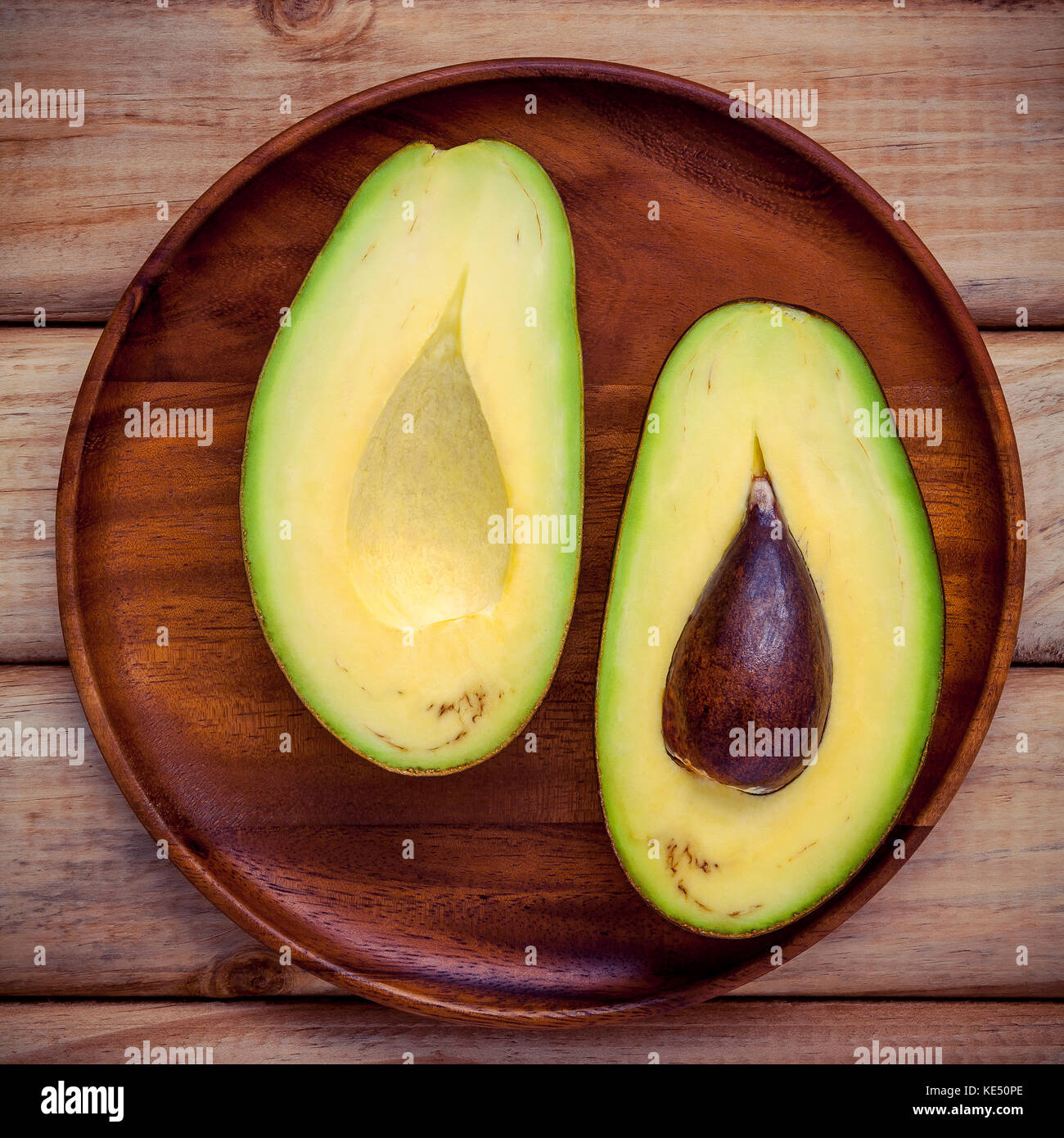 Food background with fresh organic avocado . Fresh cutting avocado on ...